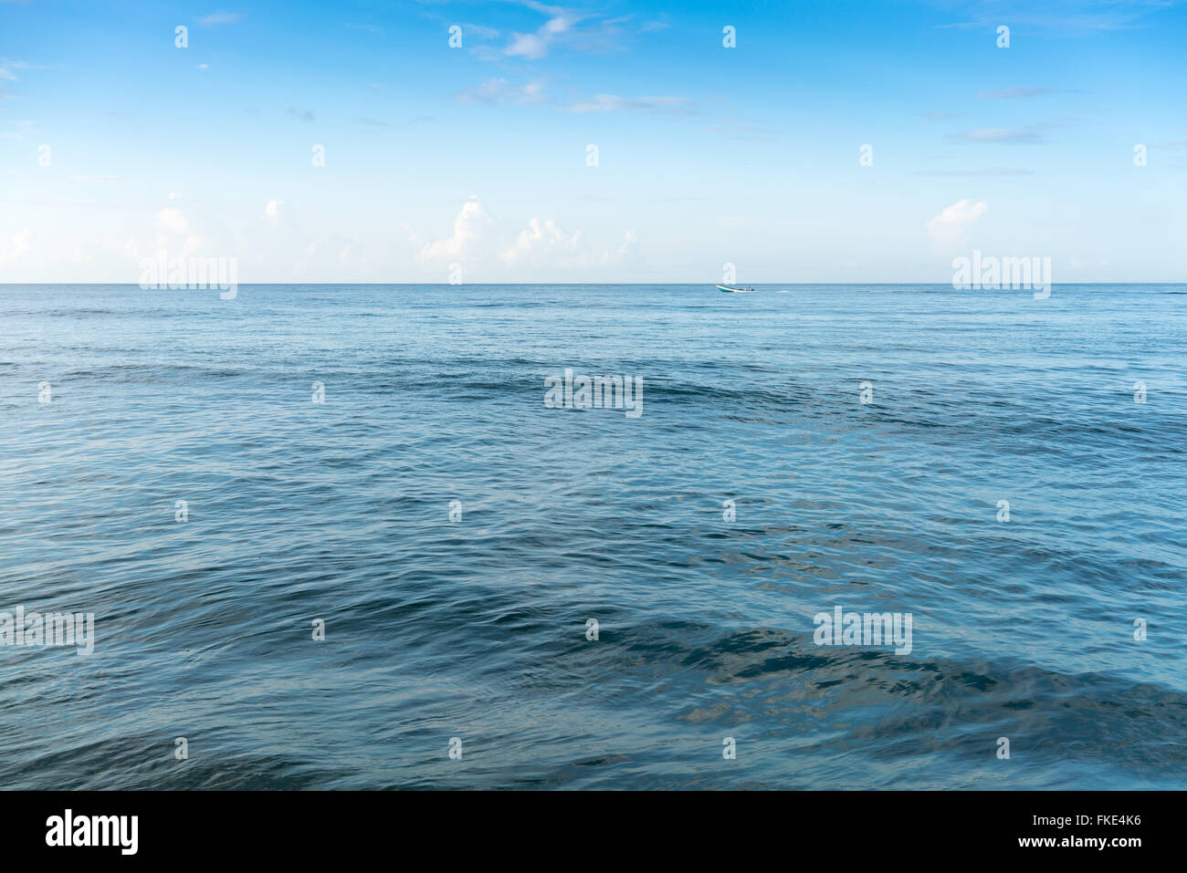 Scenic view of sea against blue sky, Trinidad, Trinidad And Tobago ...