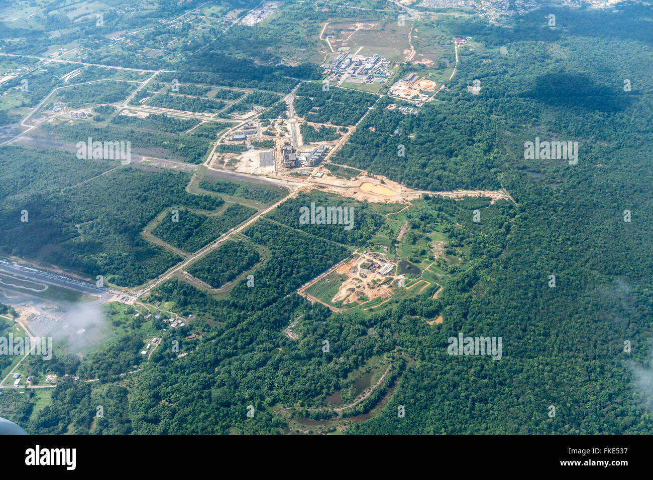 Aerial view of forest with cityscape, Trinidad, Trinidad and Tobago ...