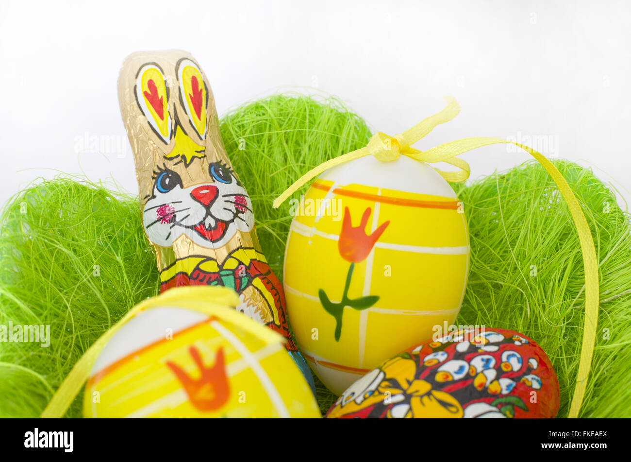 Easter Eggs with Chocolate Bunny in Green Basket Horizontal Stock Photo ...
