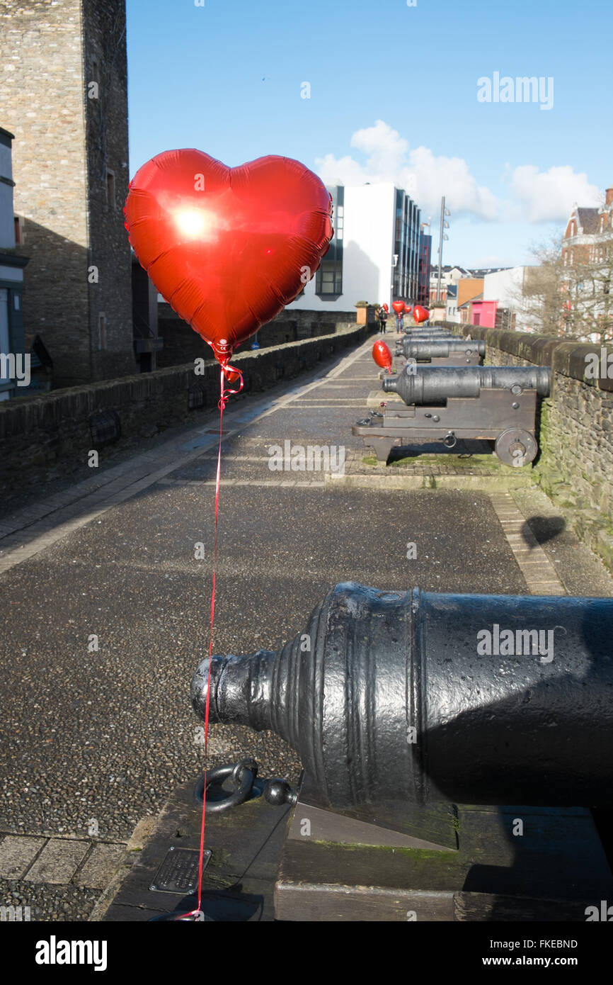 Red balloons tied to the cannons on Derry City Walls Derry Londonderry ...