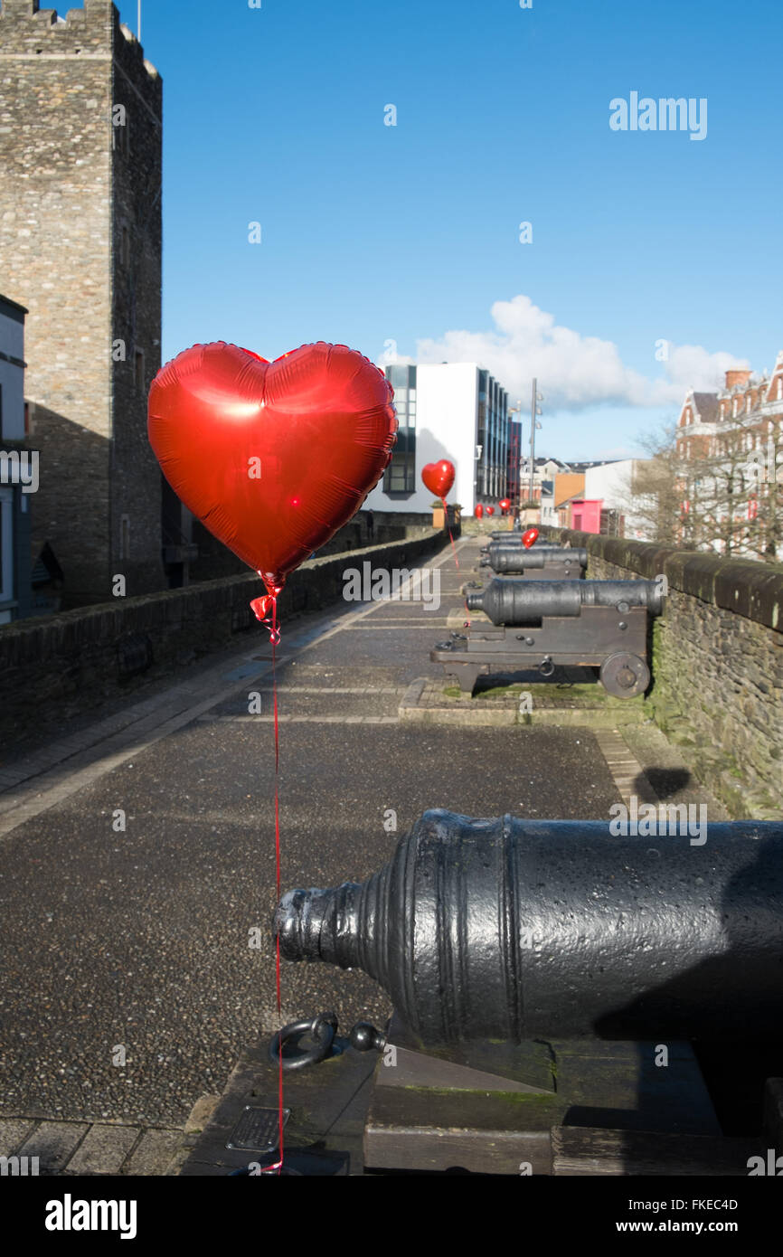 Red balloons tied to the cannons on Derry City Walls Derry Londonderry ...