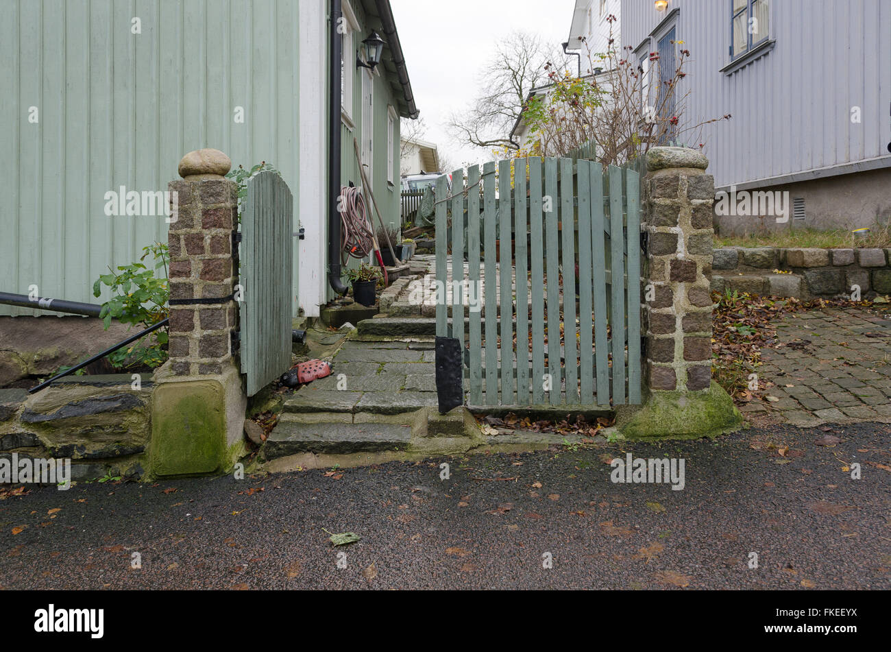 Old wooden gate in garden wall hi-res stock photography and images - Alamy
