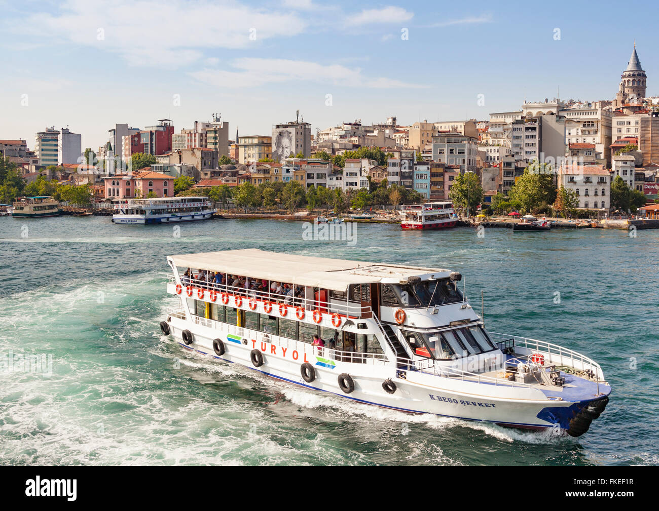 Passenger ferry in the Golden Horn, and Galata Tower, Istanbul, Turkey ...