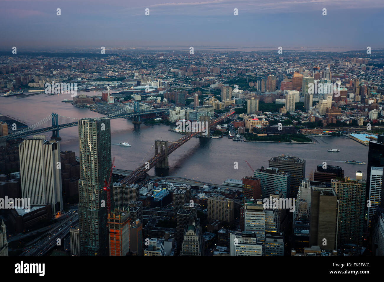Aerial view of east side of Manhattan and Brooklyn bridges showing ...