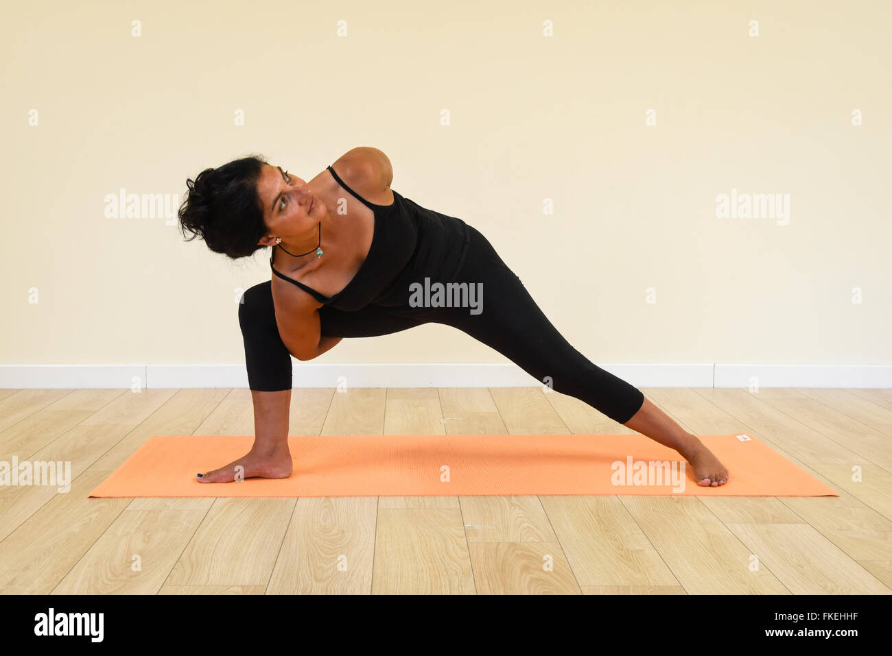 Yoga positions in studio Stock Photo - Alamy