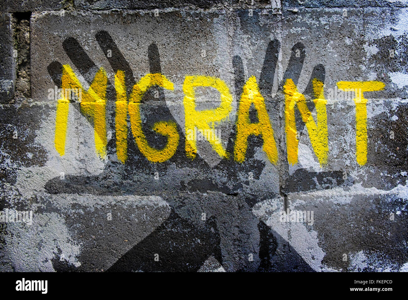 Graffiti on migration, defensive attitude, hands raised up in defense ...