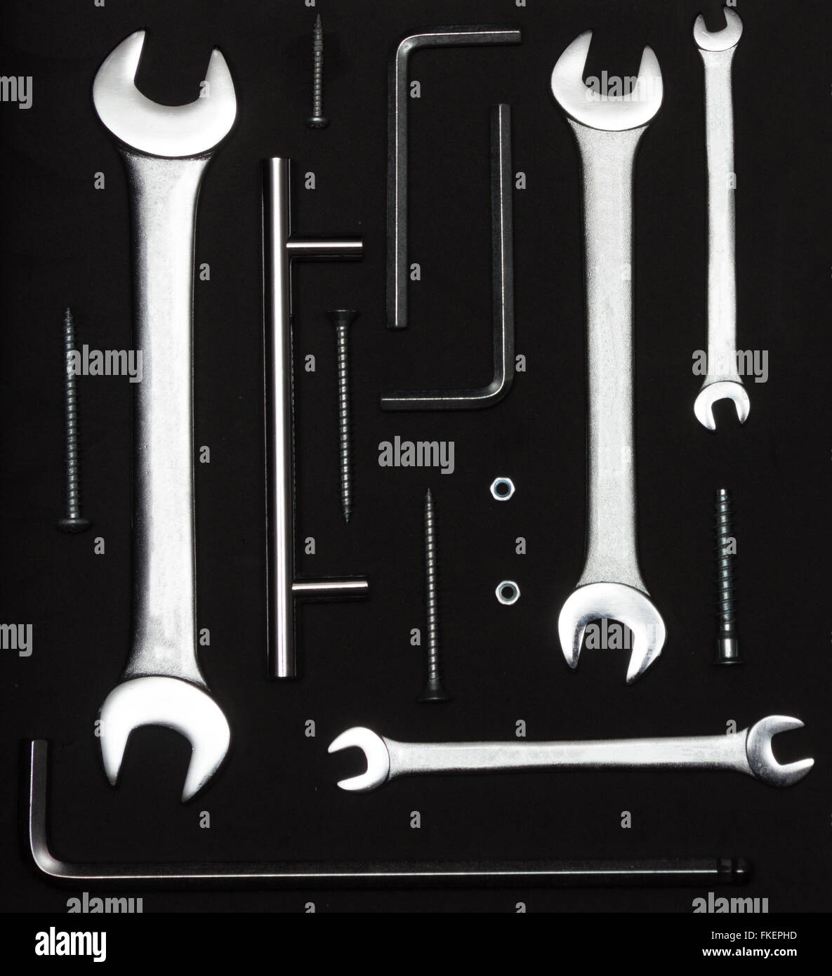 Metallic tools on a black background Stock Photo - Alamy