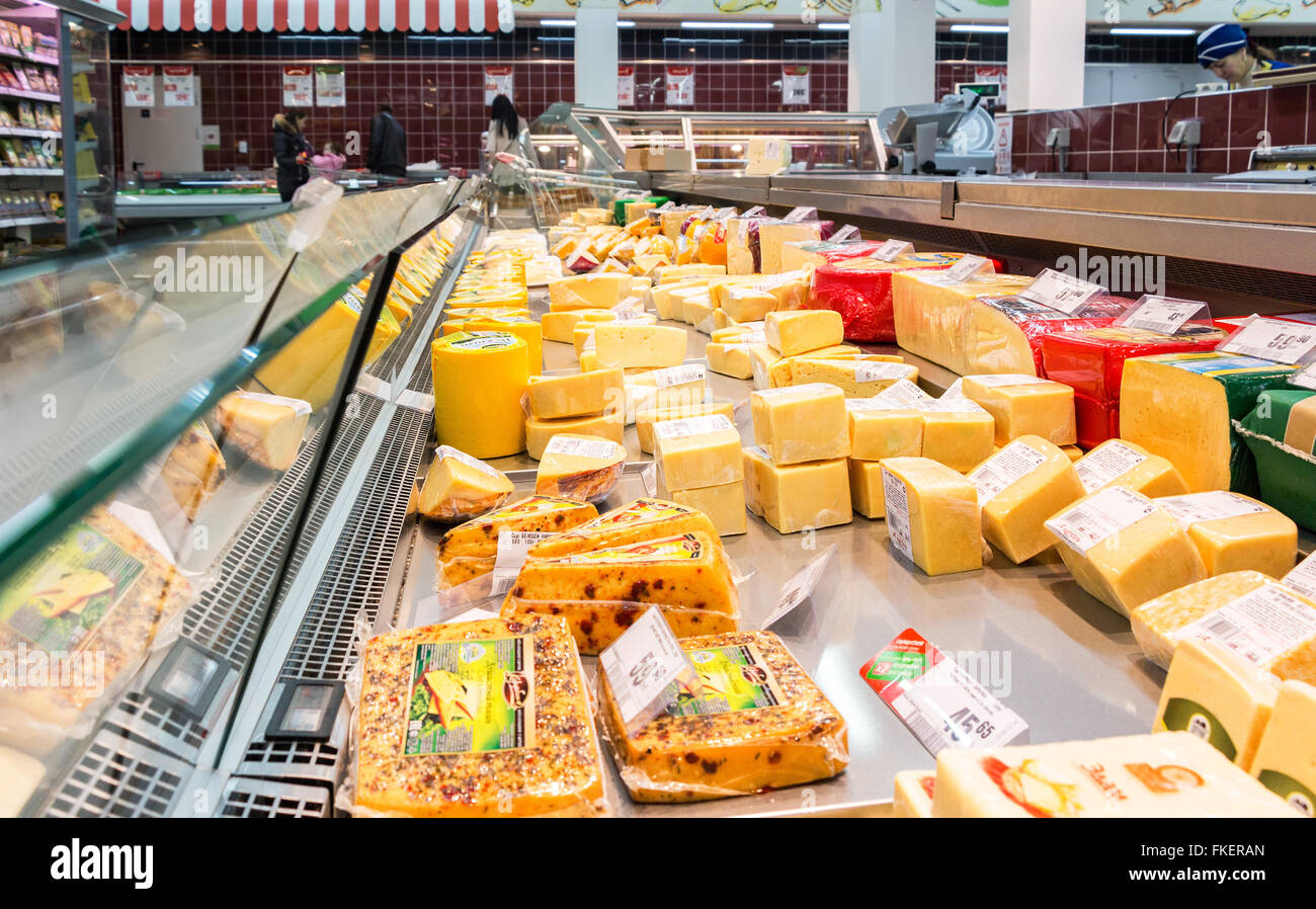Showcase with cheese ready to sale in grocery shop Stock Photo - Alamy