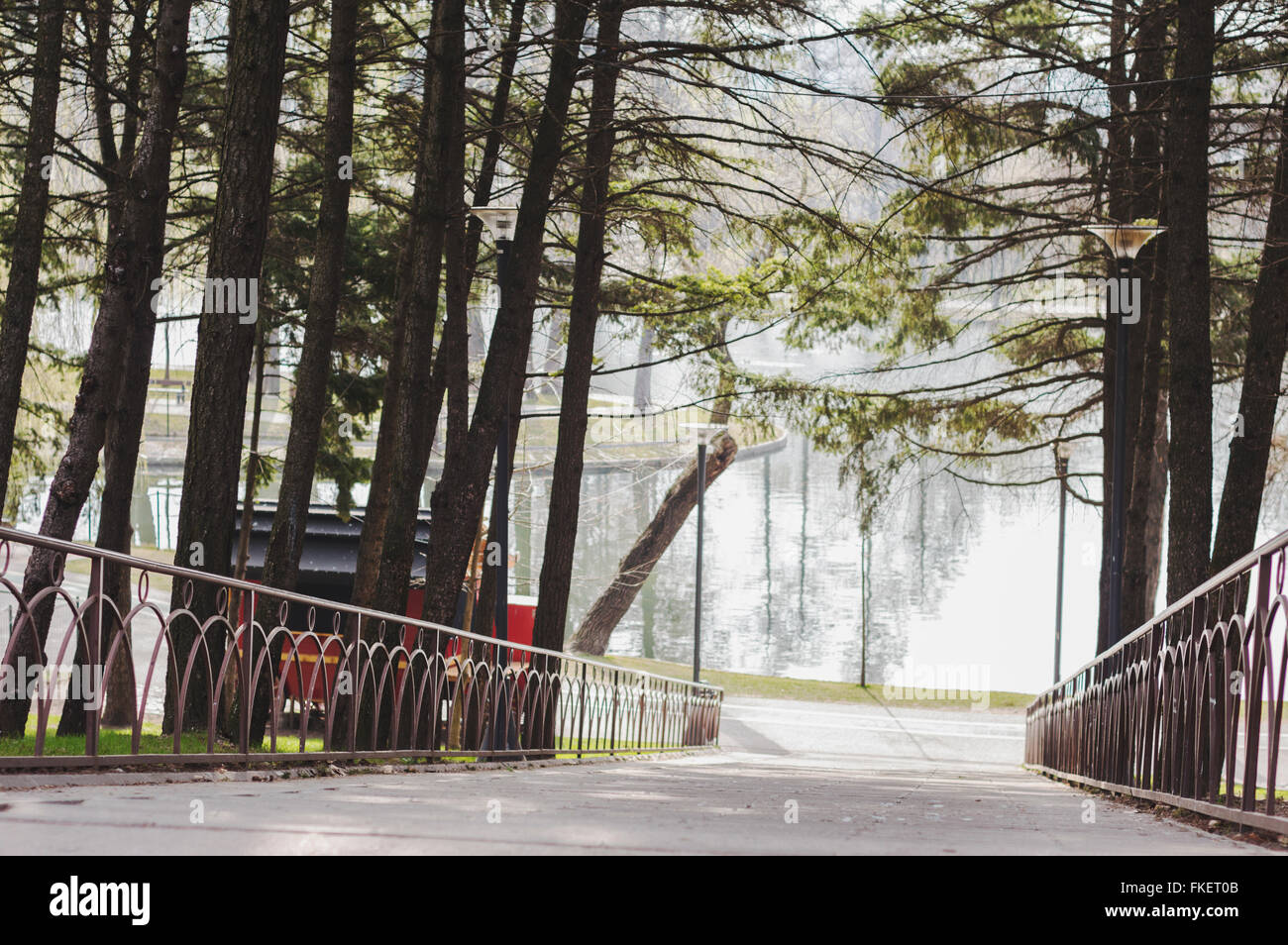 Empty alley in Titan park. Stairs towards the lake Stock Photo - Alamy
