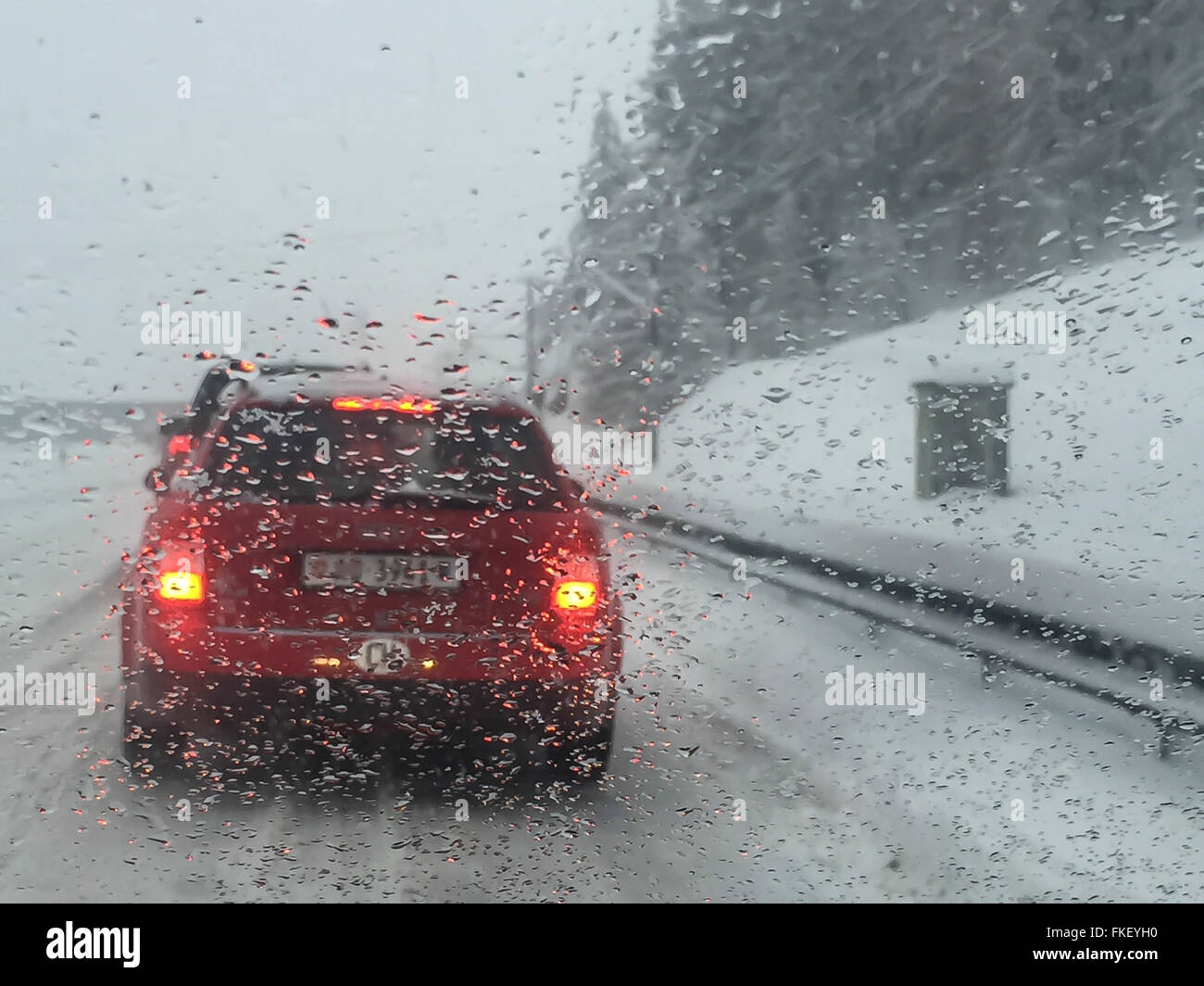 Driving in winter through the mountains. Alpine roads covered with snow ...