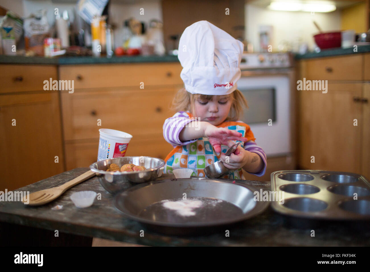 Little chef cooking in the kitchen Stock Photo - Alamy