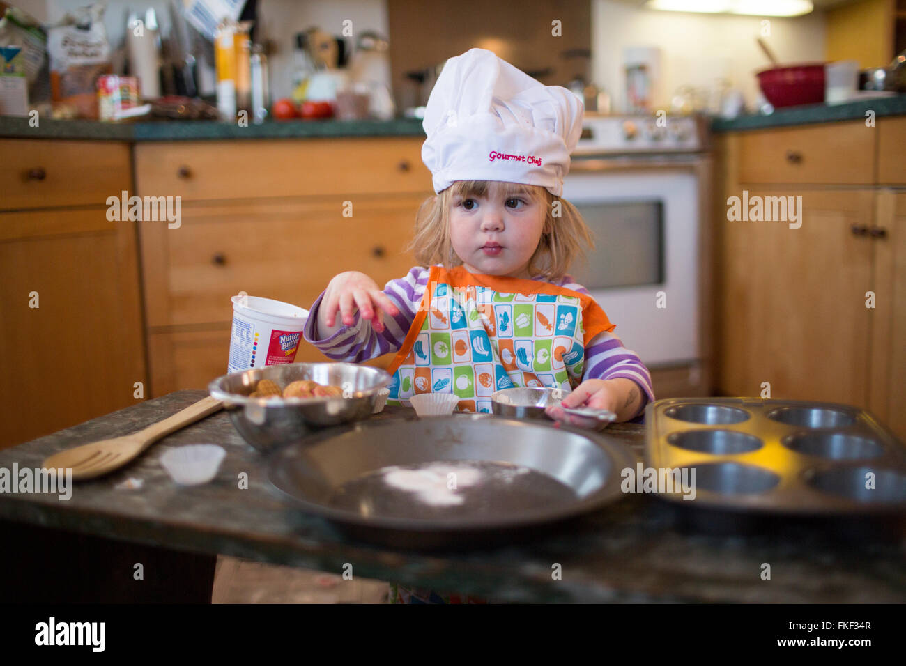Little chef cooking in the kitchen Stock Photo - Alamy
