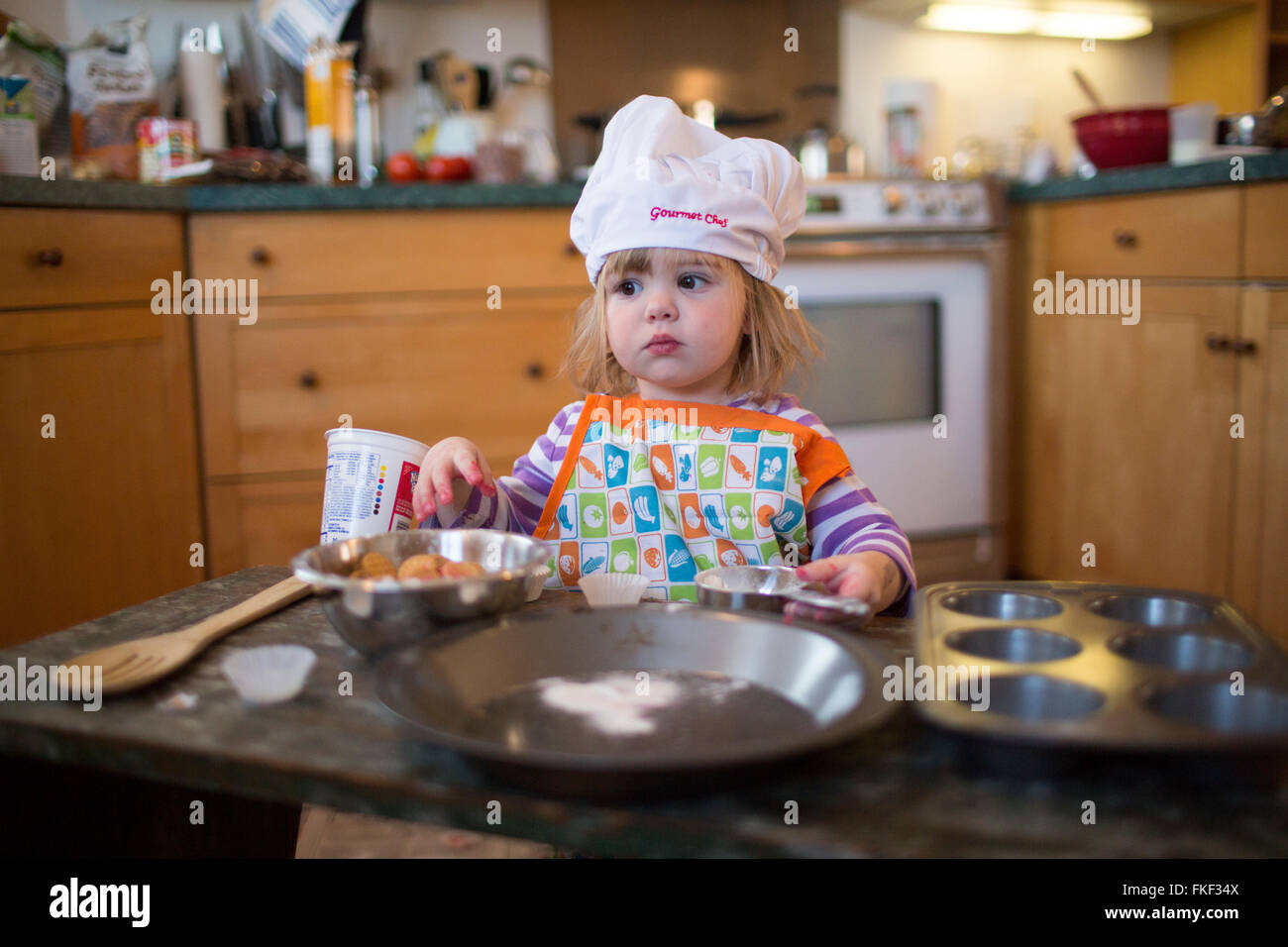 Little chef cooking in the kitchen Stock Photo - Alamy