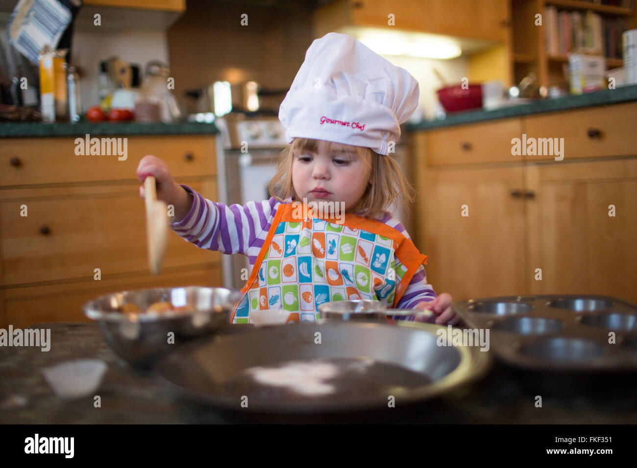 Little chef cooking in the kitchen Stock Photo - Alamy