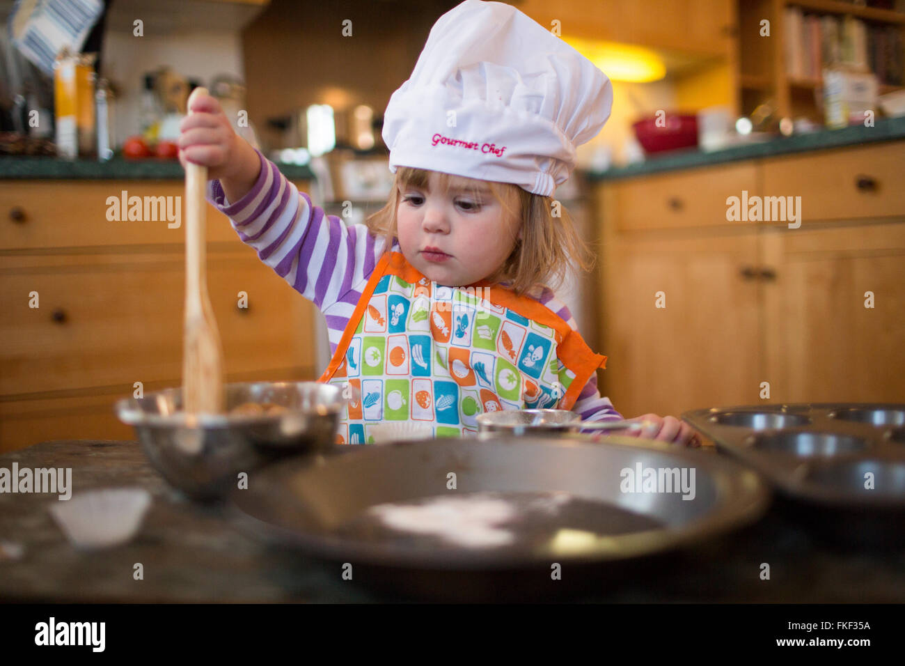 Little chef cooking in the kitchen Stock Photo - Alamy