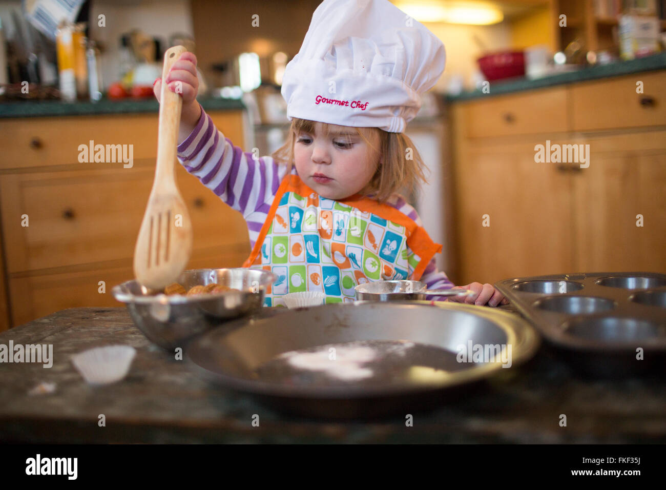 Little chef cooking in the kitchen Stock Photo - Alamy