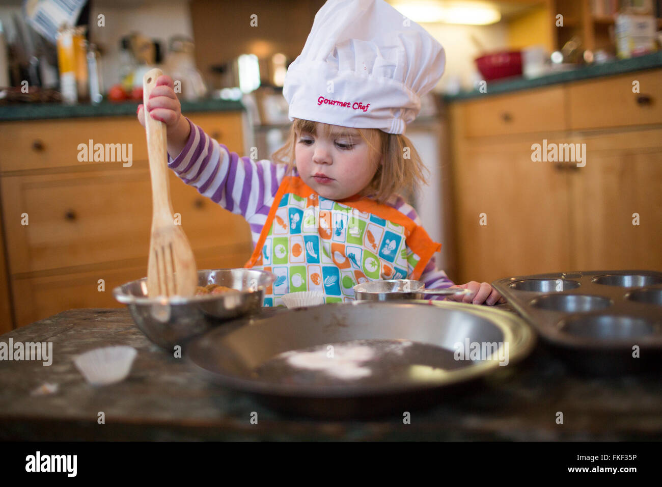 Little chef cooking in the kitchen Stock Photo - Alamy
