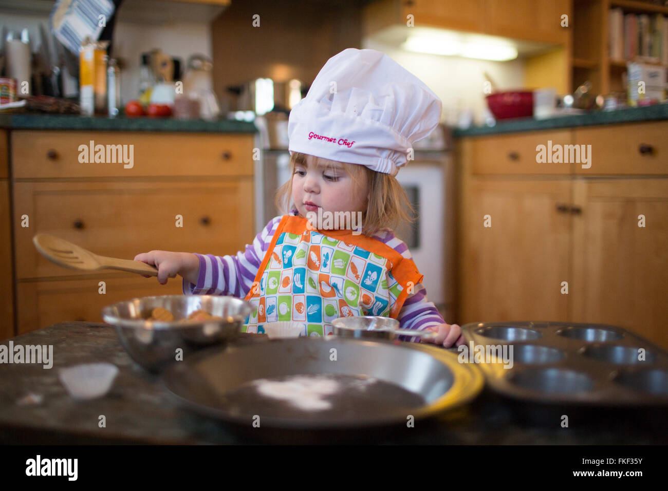 Little chef cooking in the kitchen Stock Photo - Alamy