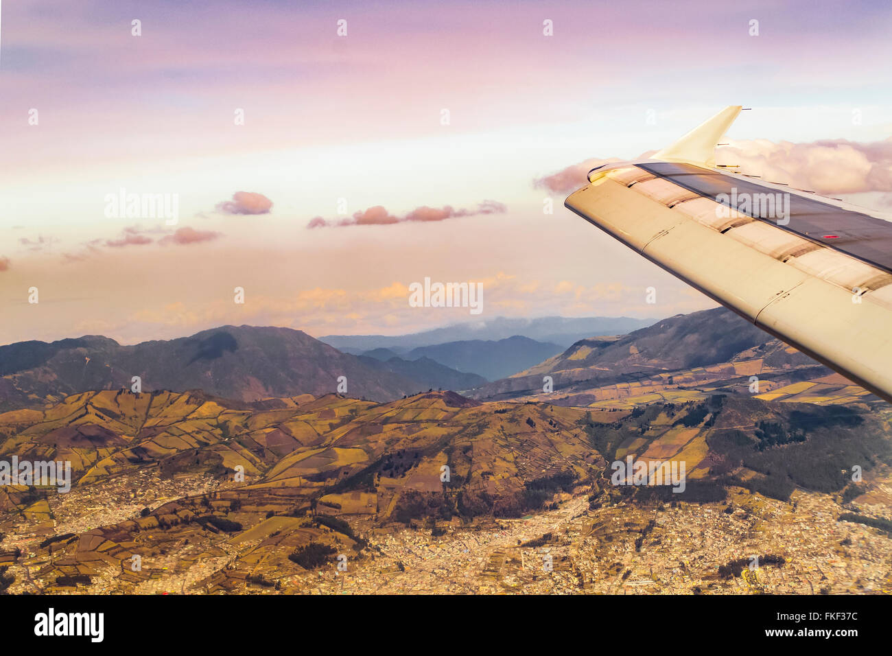 Aerial view from window plane with big mountains and sky as the main ...