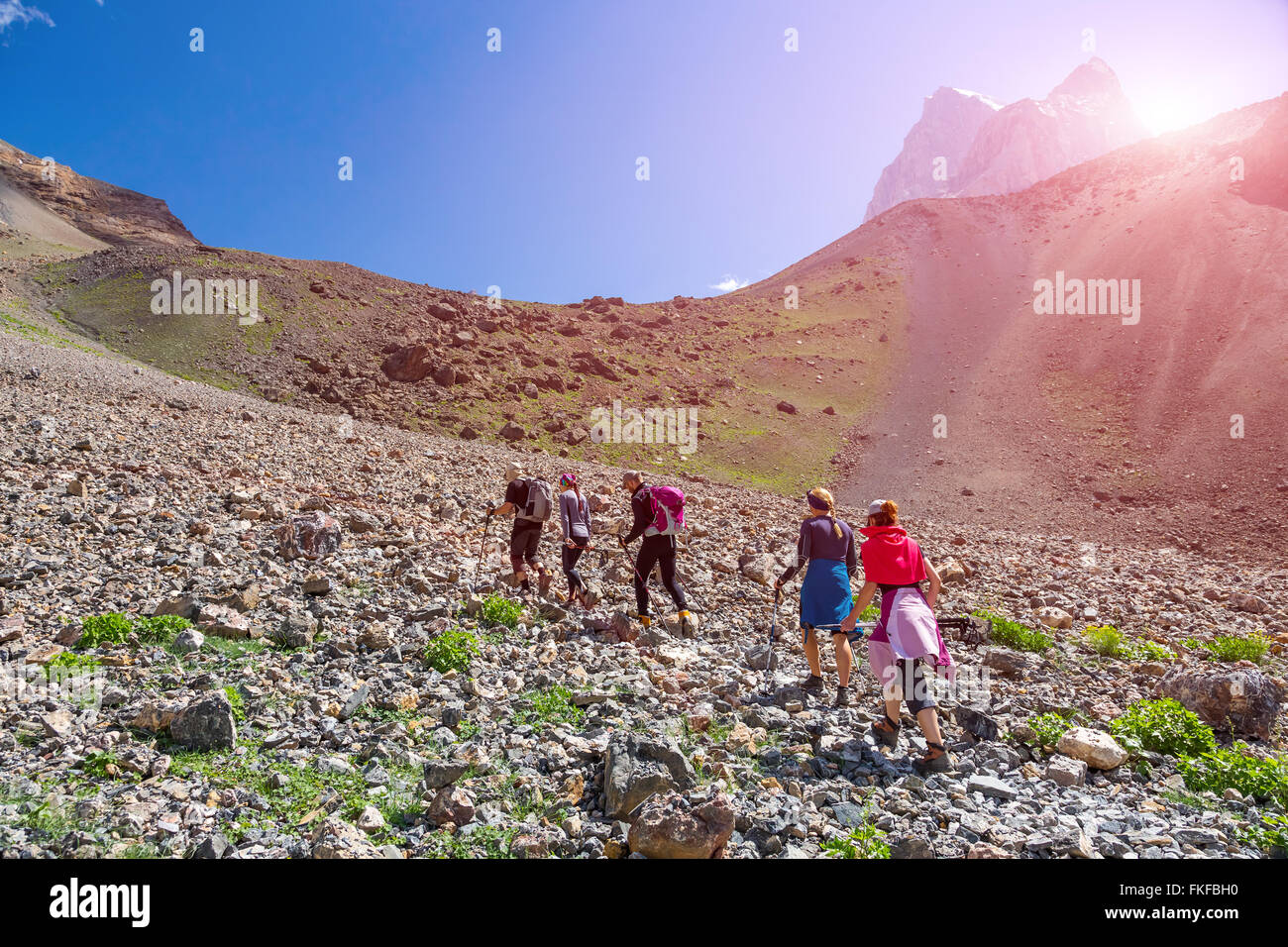 Group of people walking on trail Stock Photo - Alamy