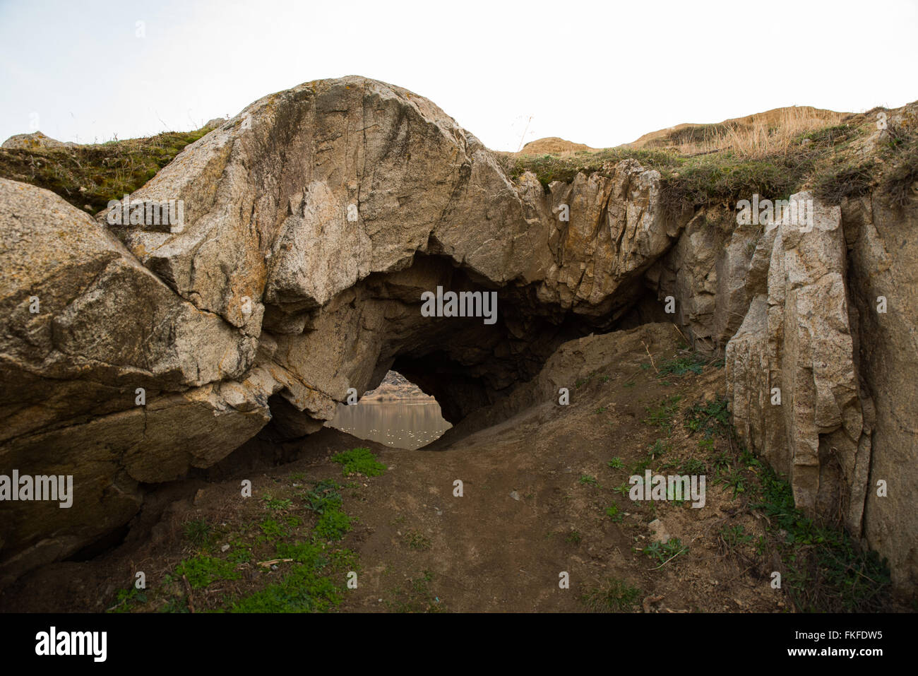 Rock cave in mountain Stock Photo - Alamy