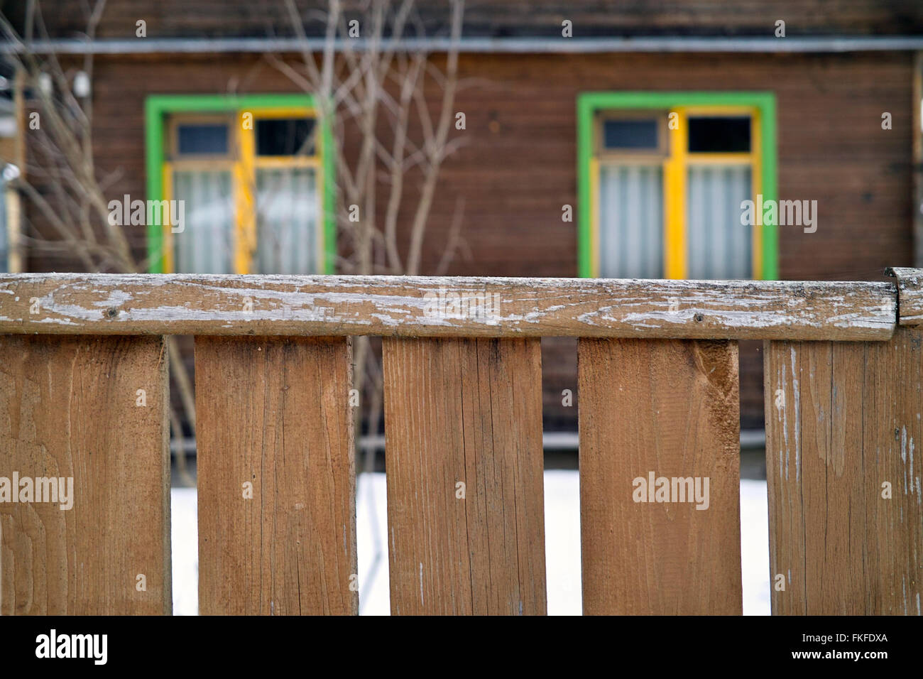 Wooden house behind fence hi-res stock photography and images - Alamy