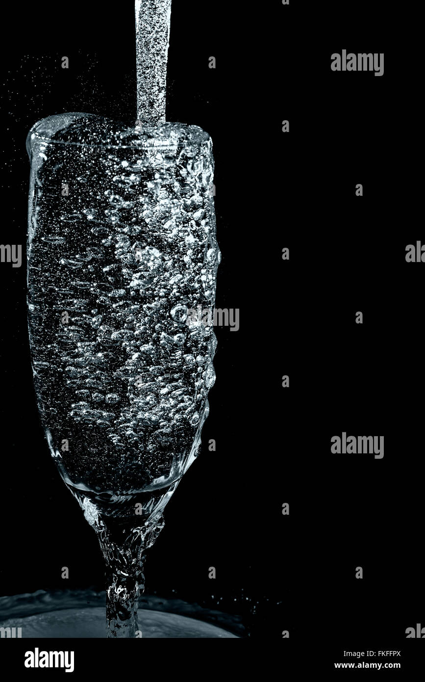 Water splashing into crystal glass hi-res stock photography and images ...