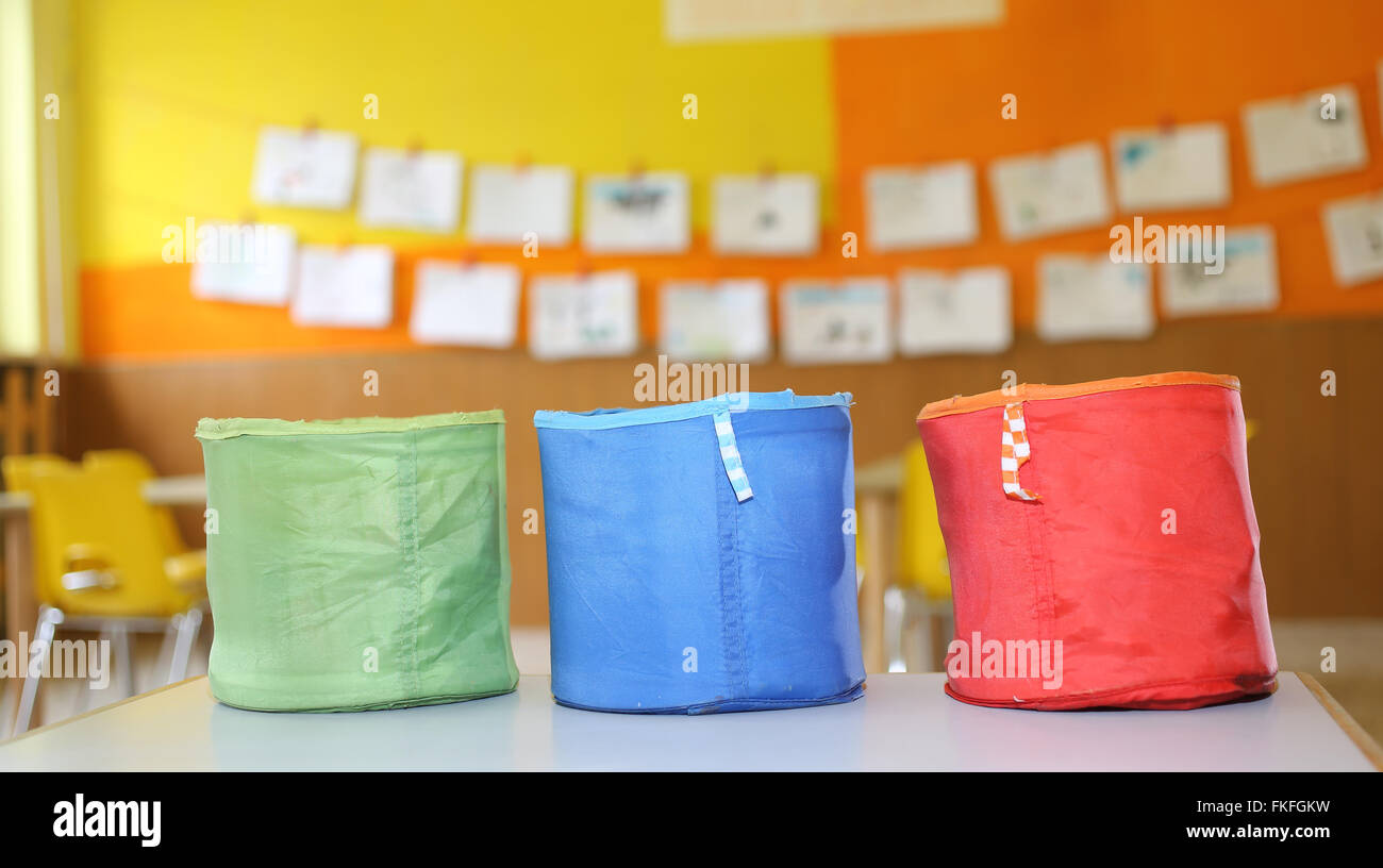 three colored containers for children's toys in the kindergarten Stock ...