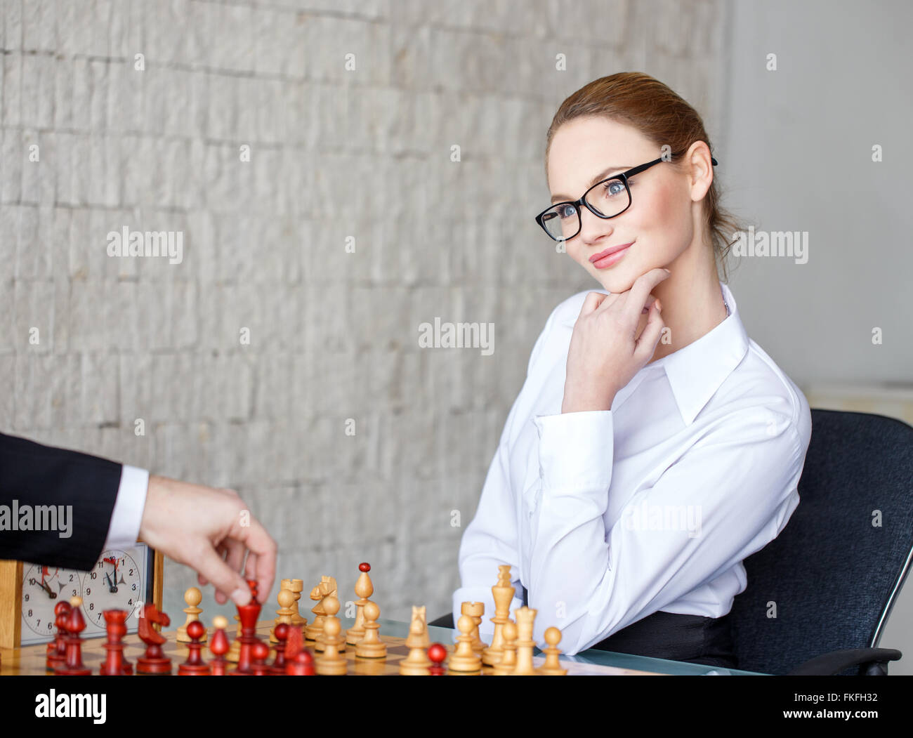 Confident woman winning chess game, strategy Stock Photo - Alamy
