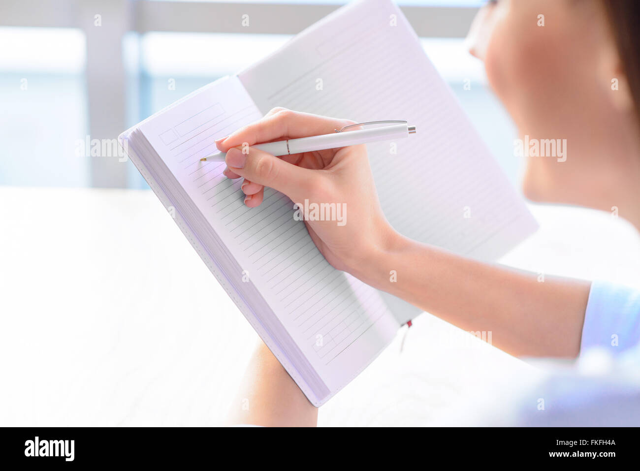 Woman making notes outside hi-res stock photography and images - Alamy