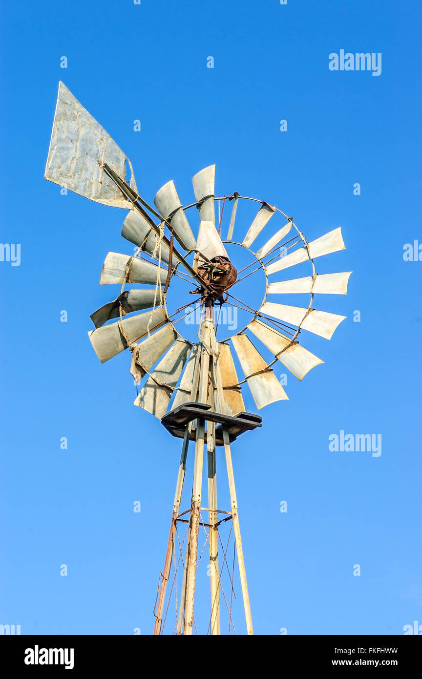 Old rusty windmill with some broken blades Stock Photo - Alamy