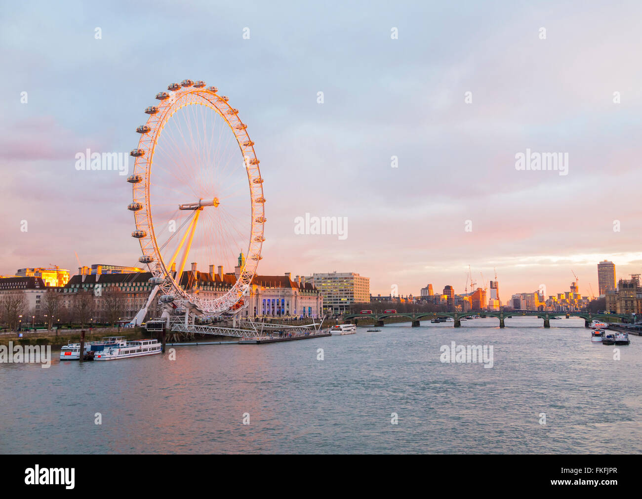 Iconic sights: Soft evening light on the famous London Eye as the sun ...
