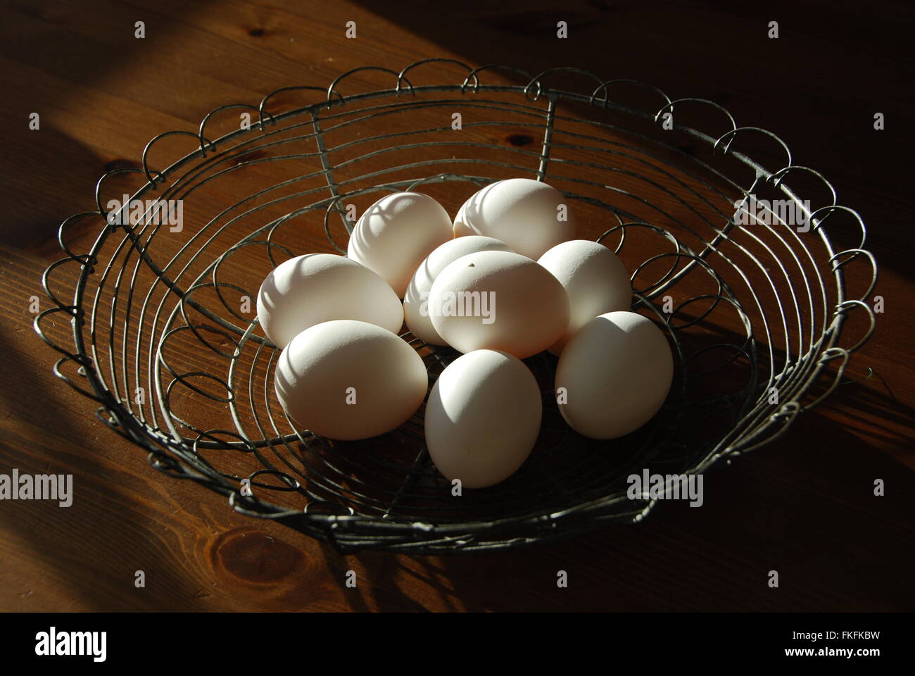 Eggs in a basket Stock Photo - Alamy