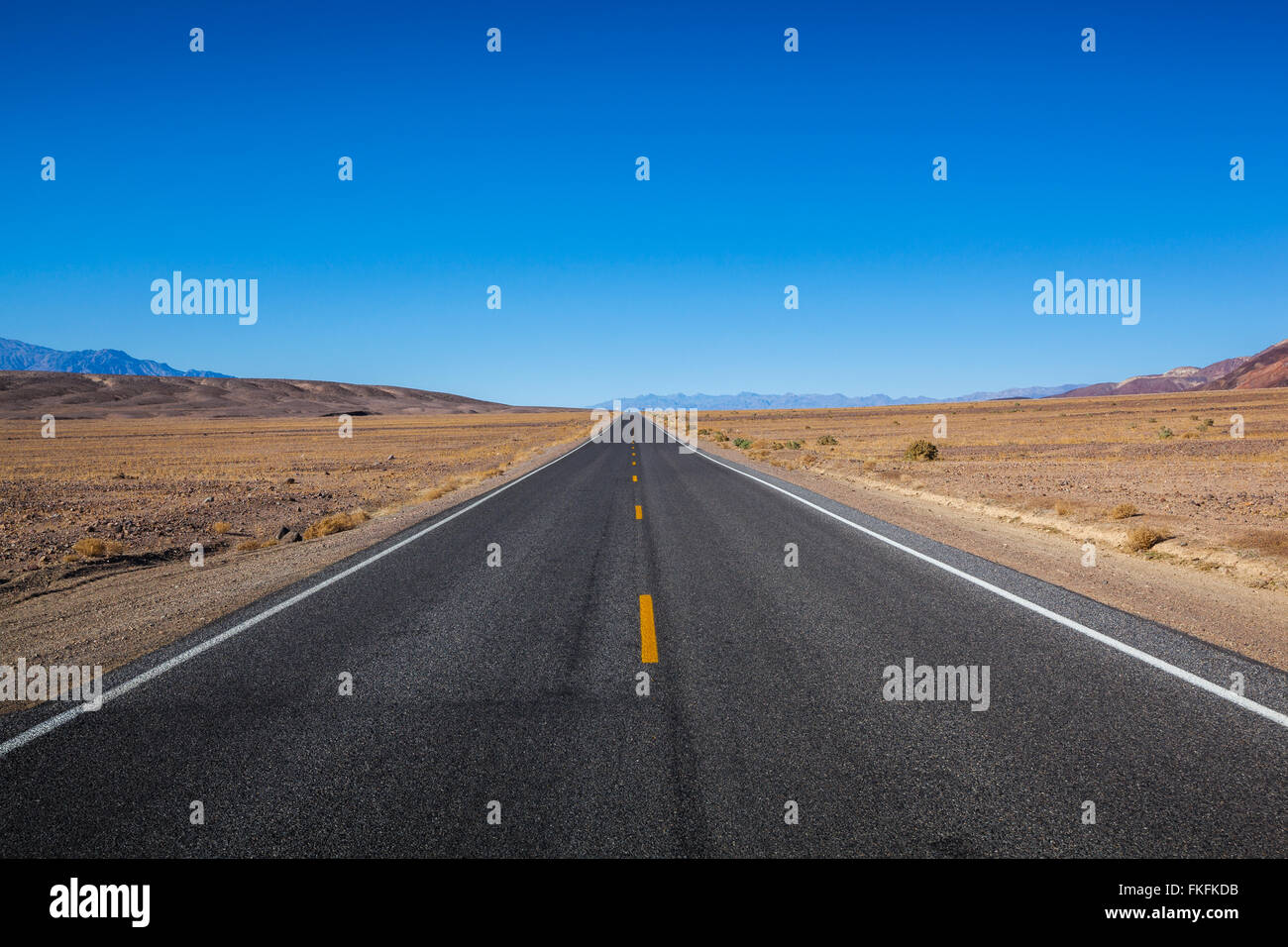 Endless straight road in Death Valley National Park, California, USA ...