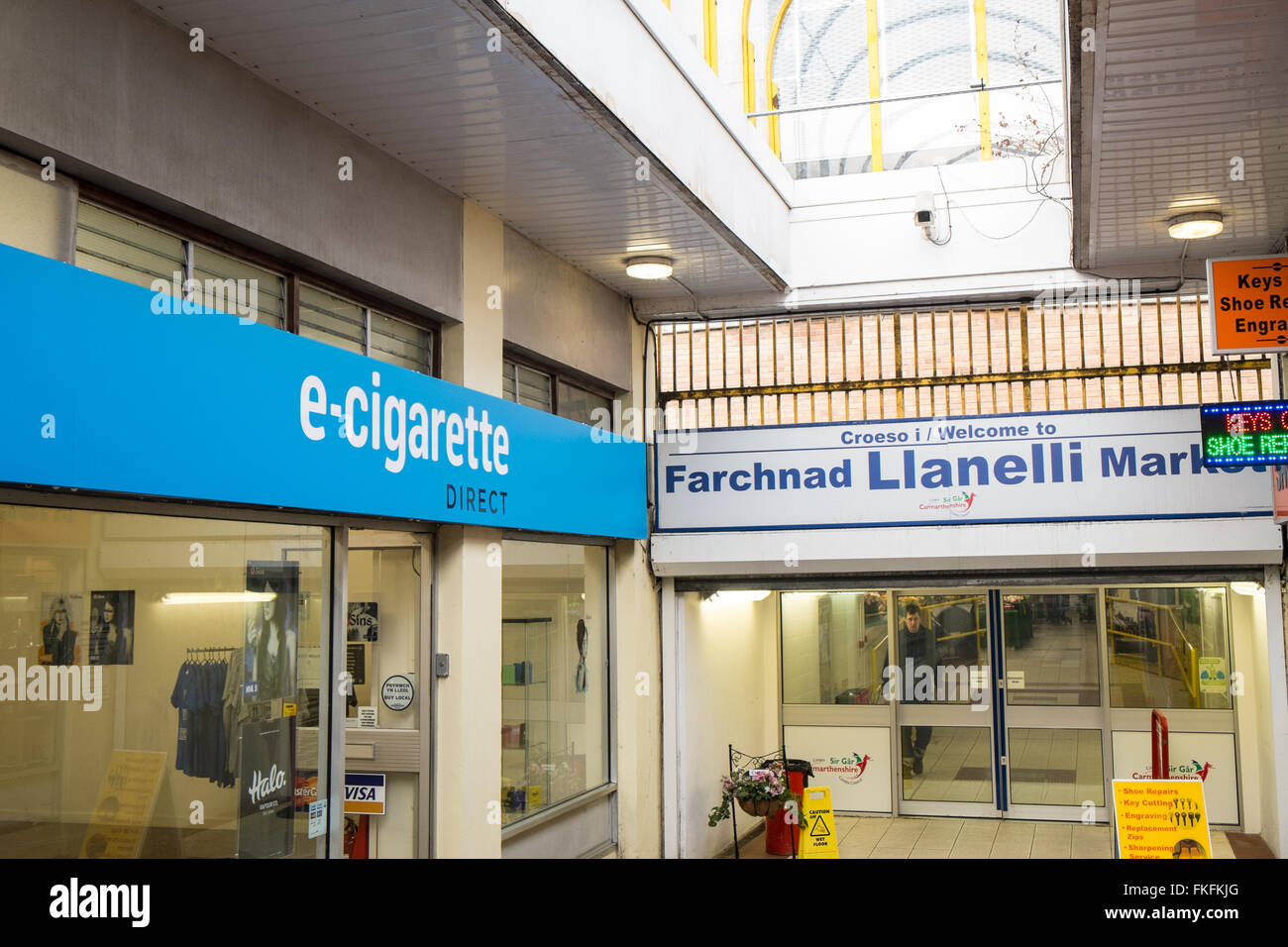 Covered market shopping mall area zone with, electric, cigarette, shop ...