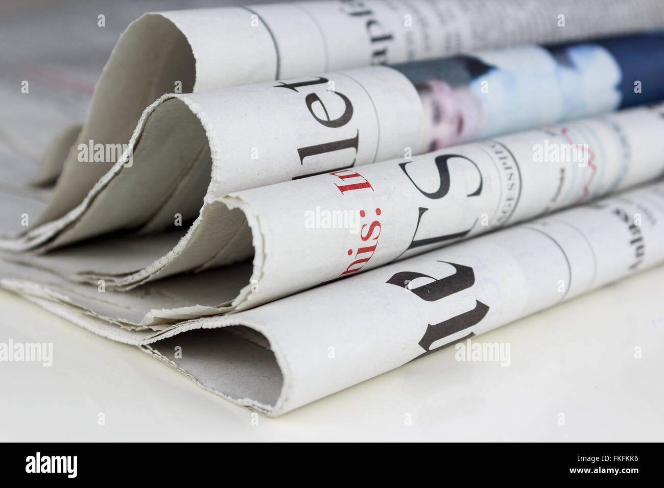Pile of newspapers, stack of newspaper Stock Photo - Alamy