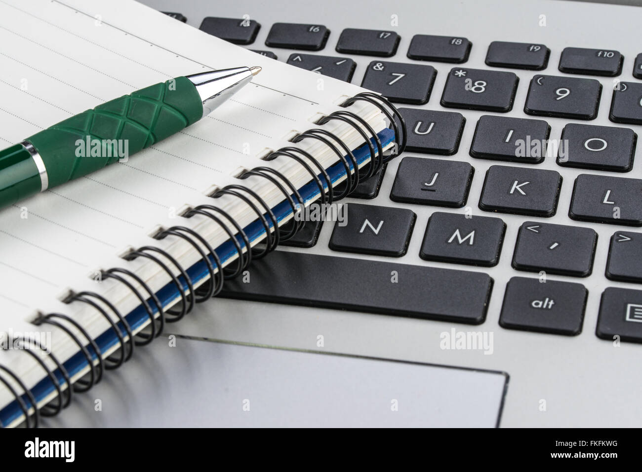 notebook and pen on the laptop keyboard, meeting, close up Stock Photo ...