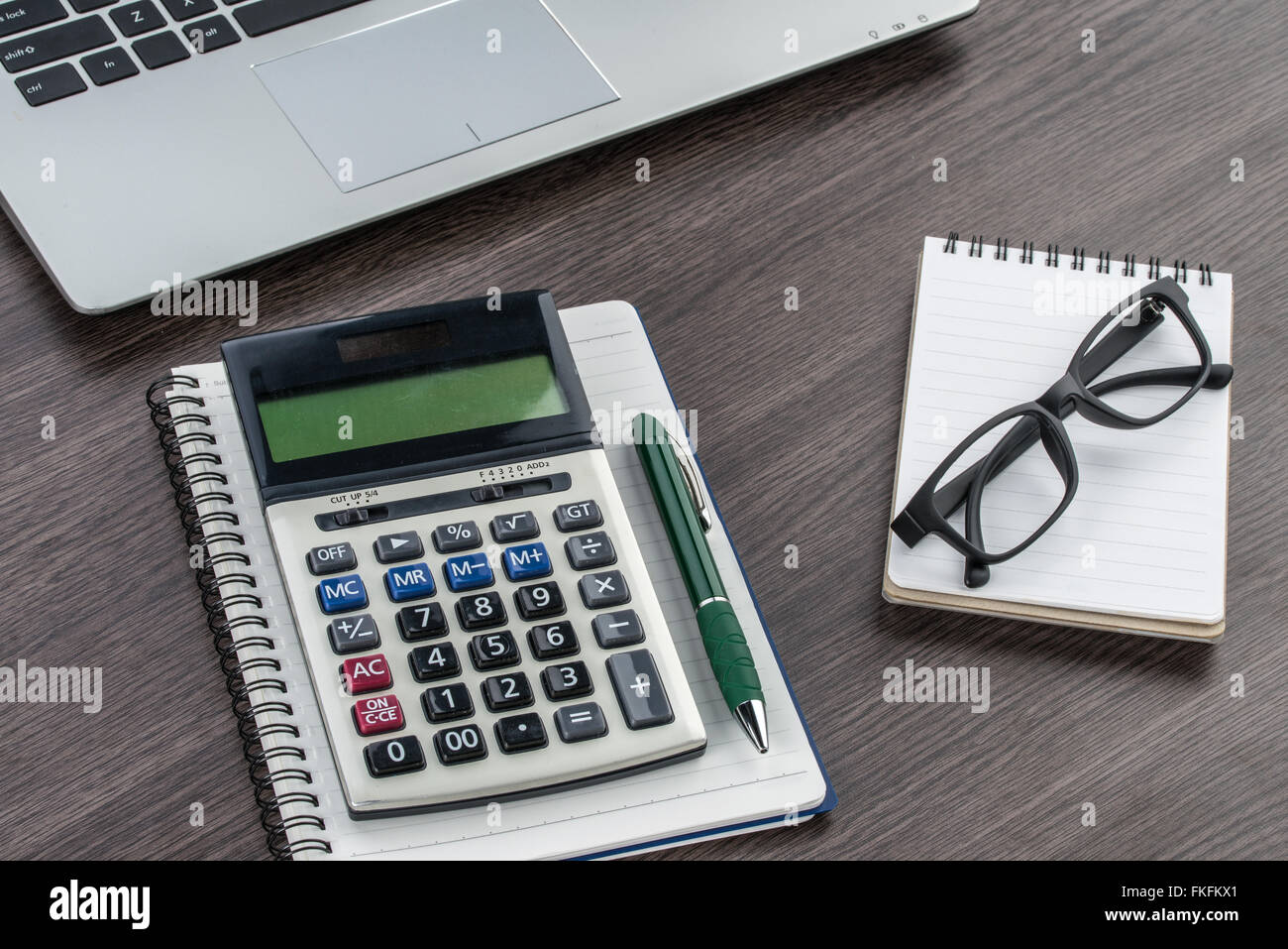 Book calculator paper laptop hi-res stock photography and images - Alamy