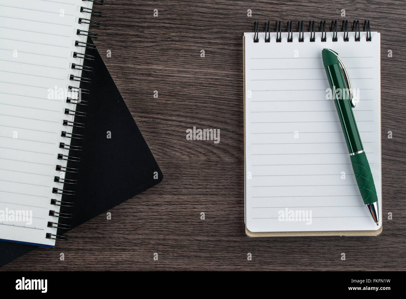 notebook stack on the wood background with pen, stationery Stock Photo ...