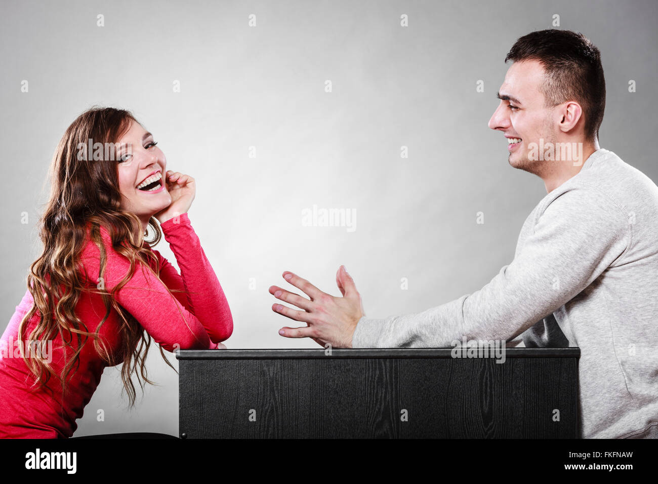 Happy couple talking and laughing on date. Smiling girl and guy having ...