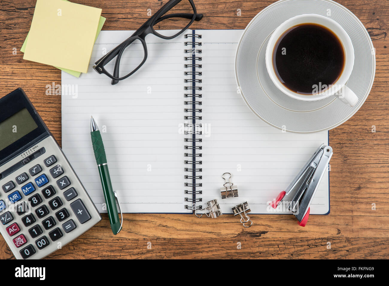 notebook Calculator Stapler and cup of coffee, workplace Stock Photo ...