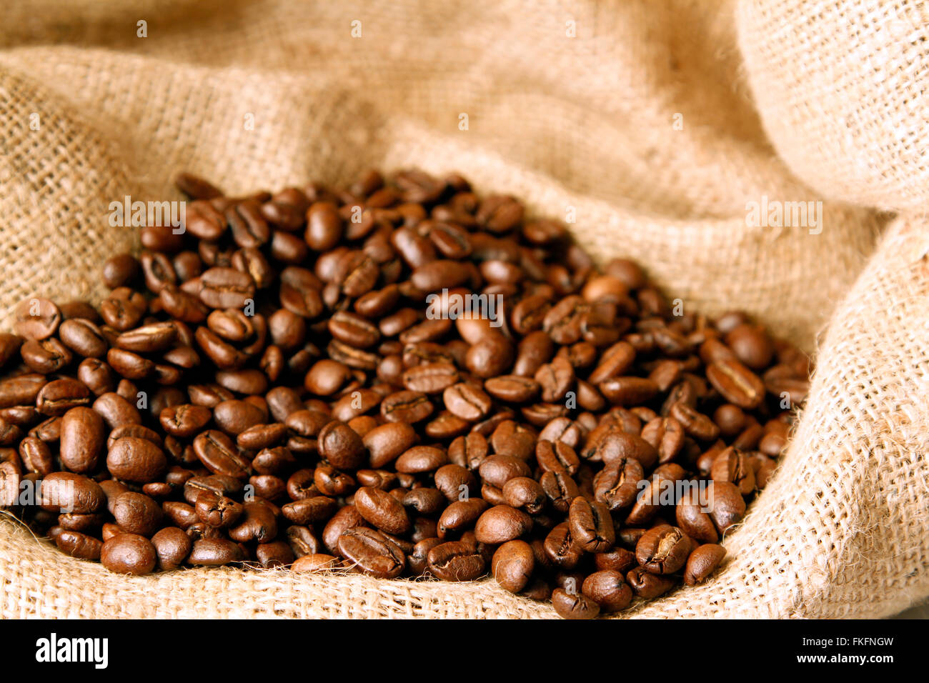 Roasted coffee beans on sacking Stock Photo - Alamy