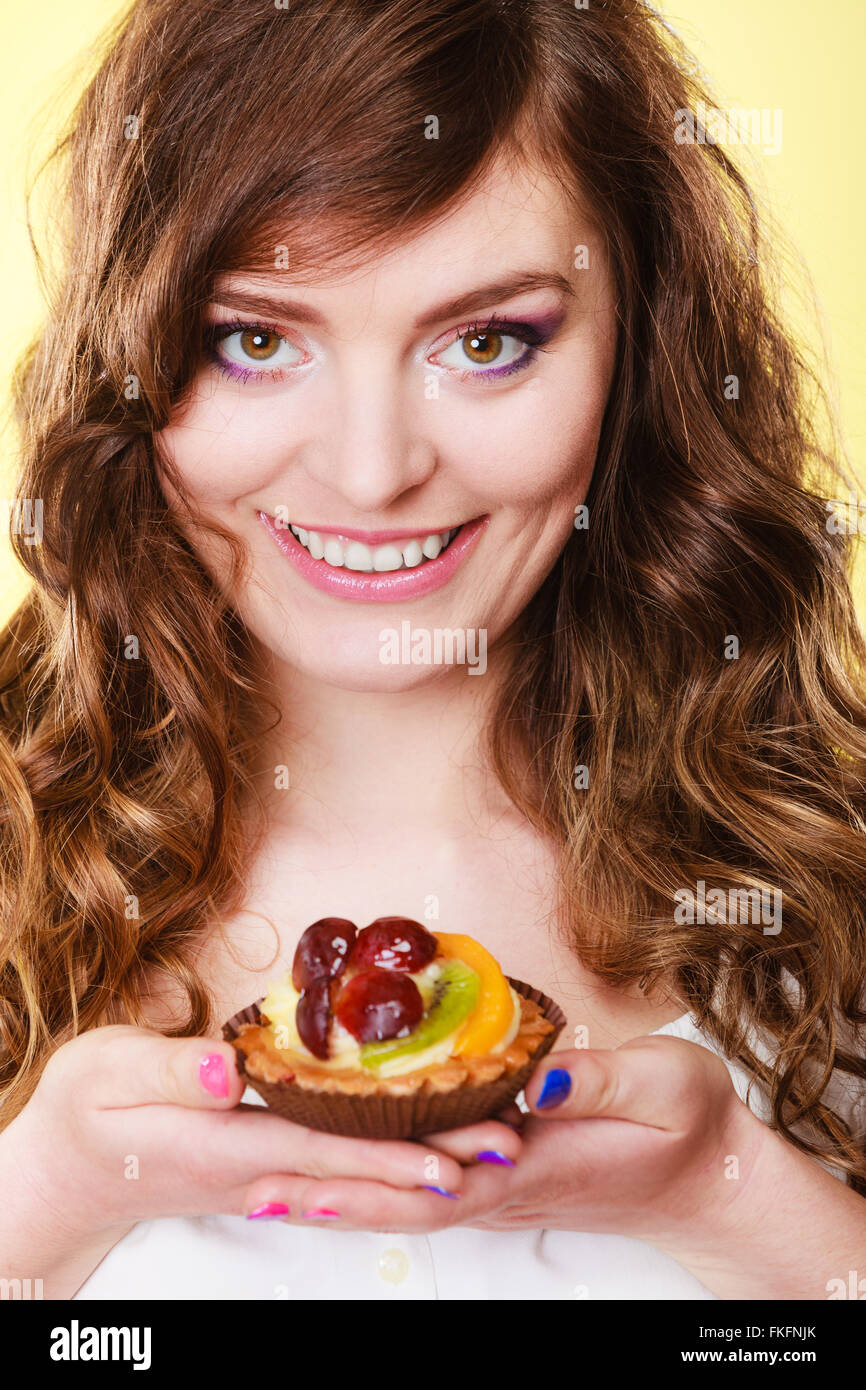 Bakery, sweet food and people concept. smiling cute woman curly hair ...