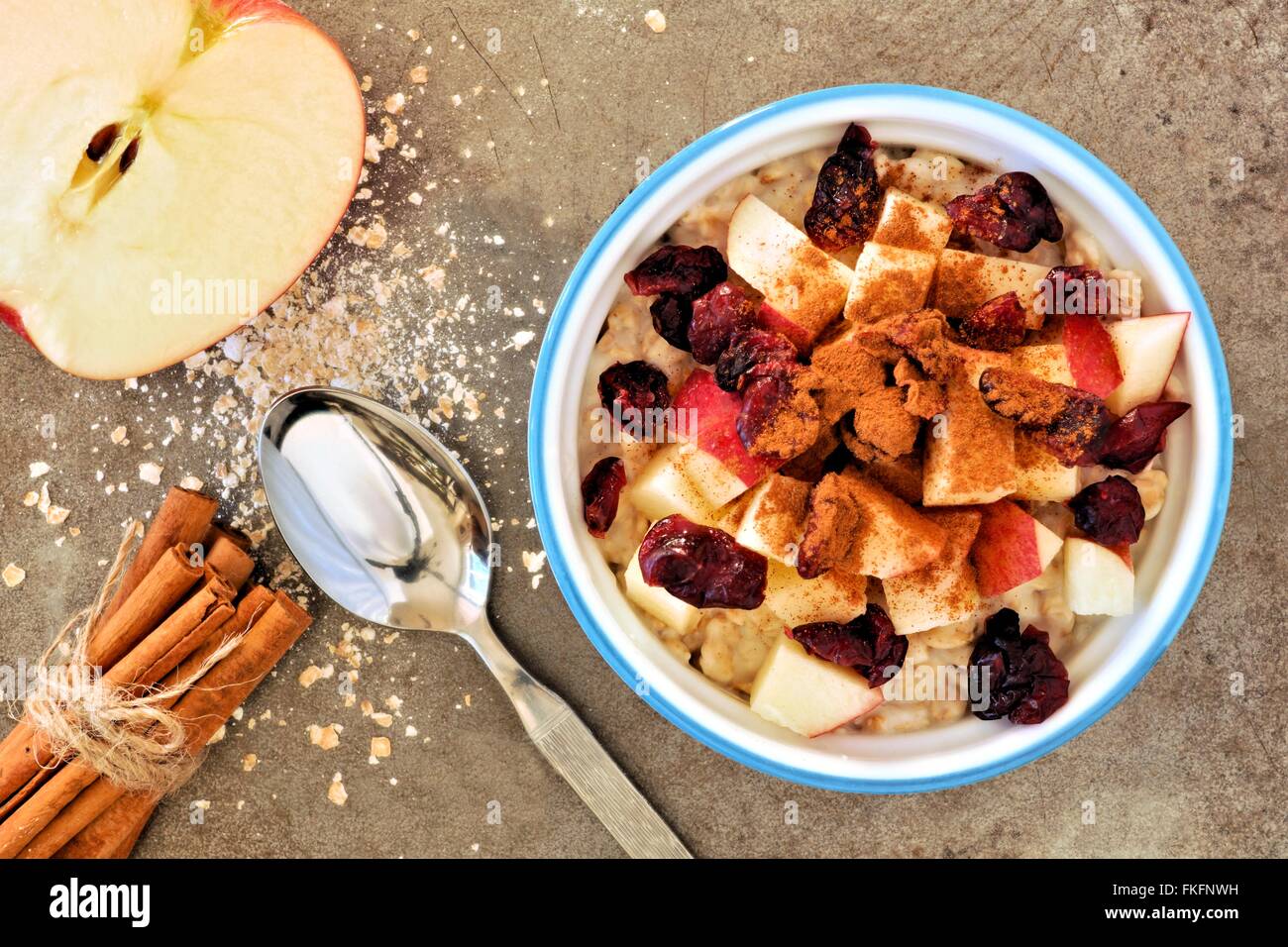Autumn inspired oatmeal with apples and cranberries, overhead scene on ...