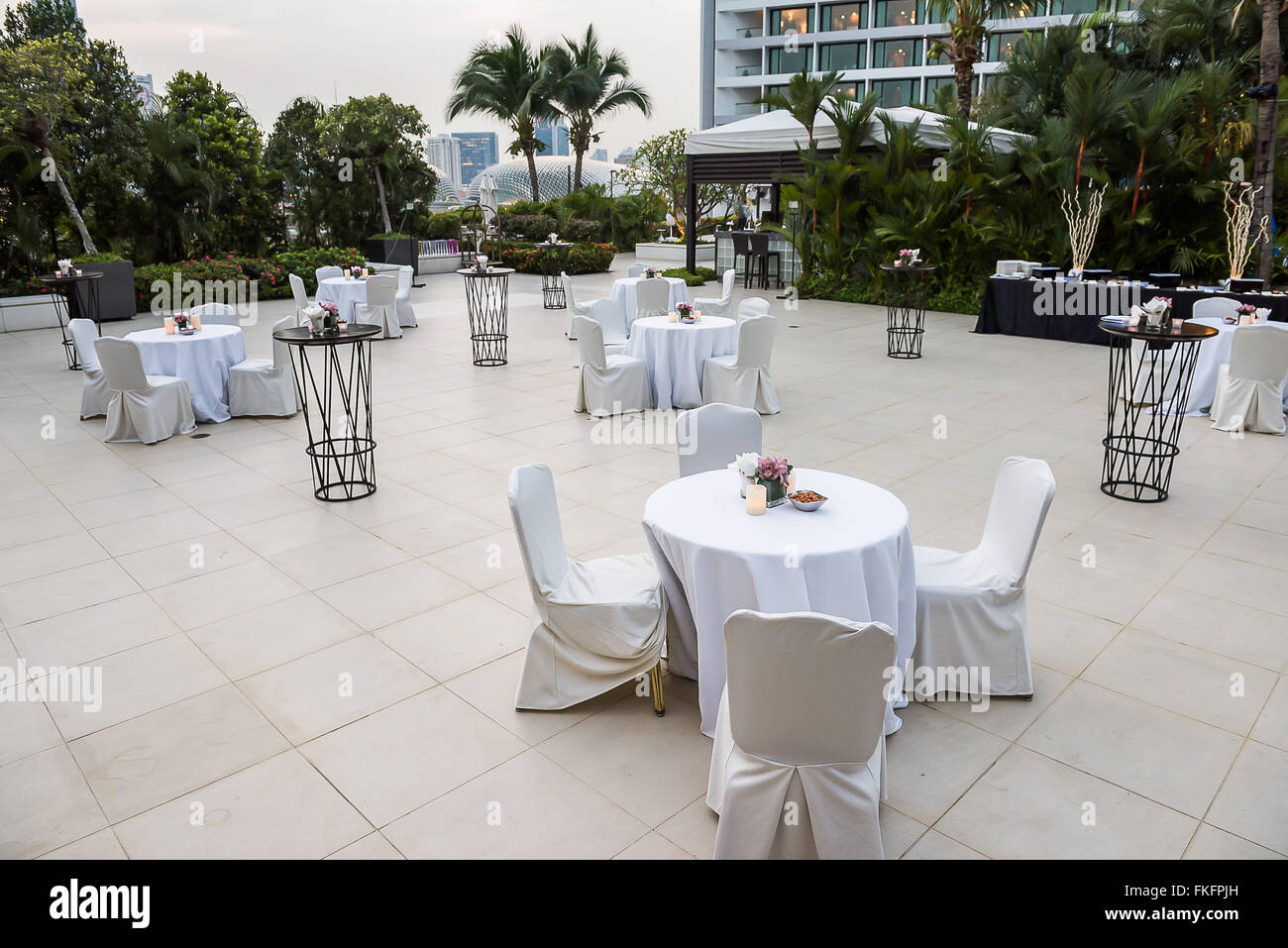 Tables and chairs set up for networking reception Stock Photo - Alamy