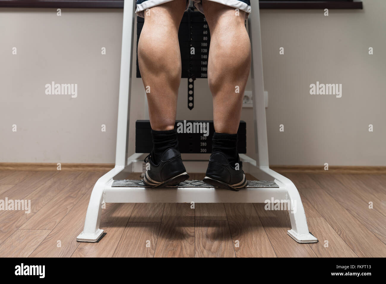 Bodybuilder Doing Heavy Weight Exercise For Legs Calves Stock Photo - Alamy