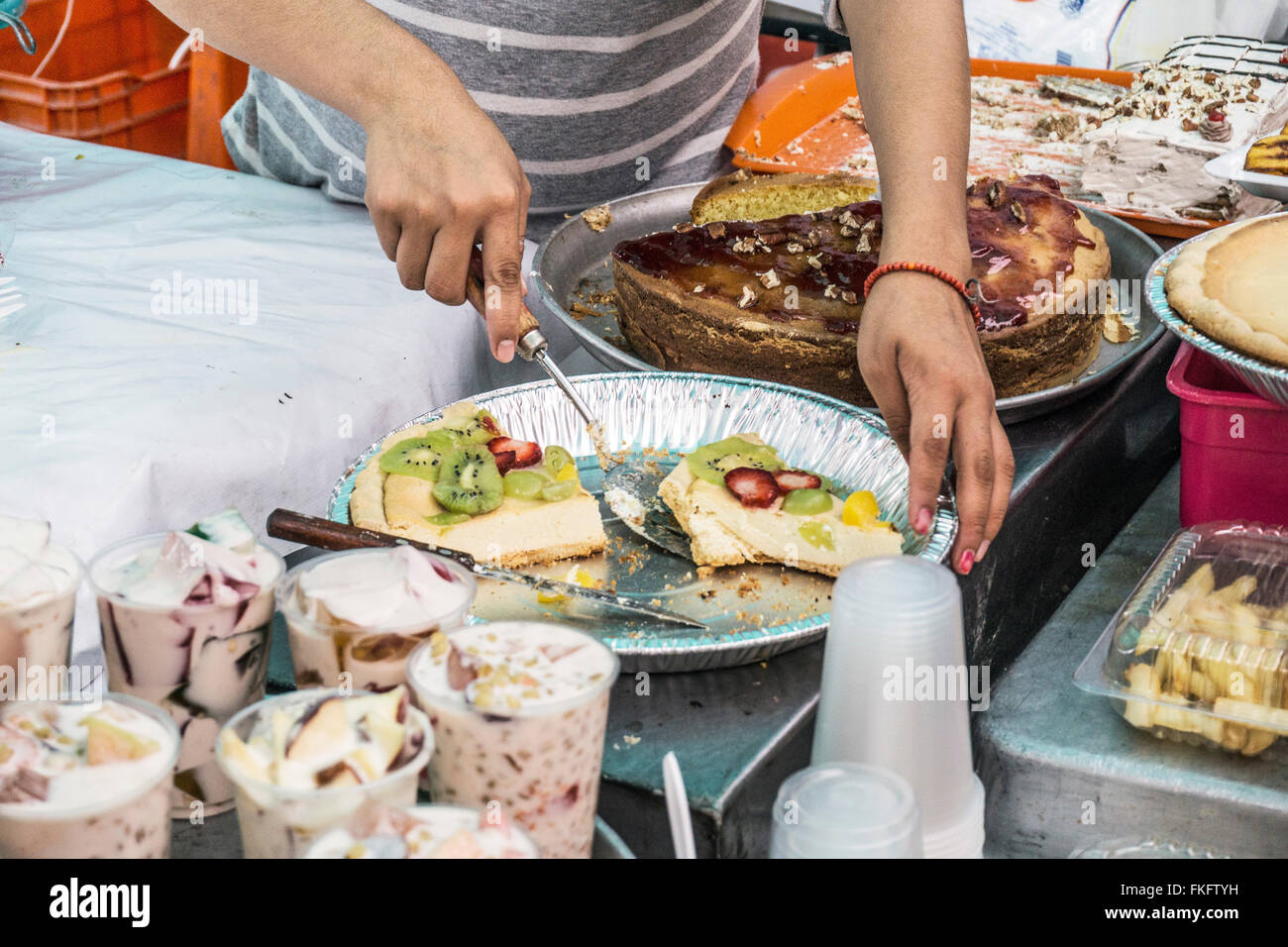 pastry booth cook serving delicious piece custard pie topped by slices ...