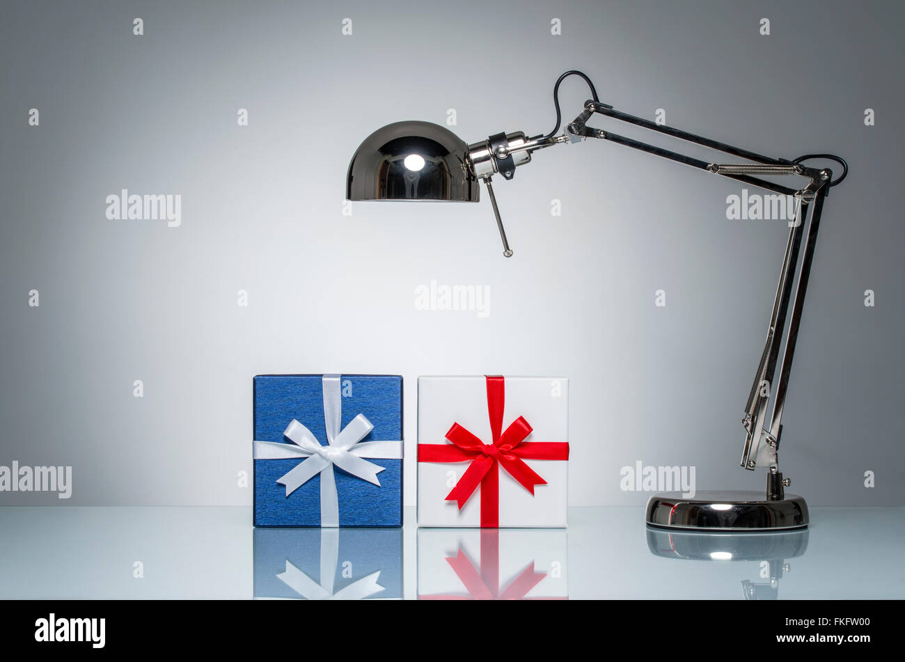 lighting up gift box present with desk lamp on round studio lighting ...