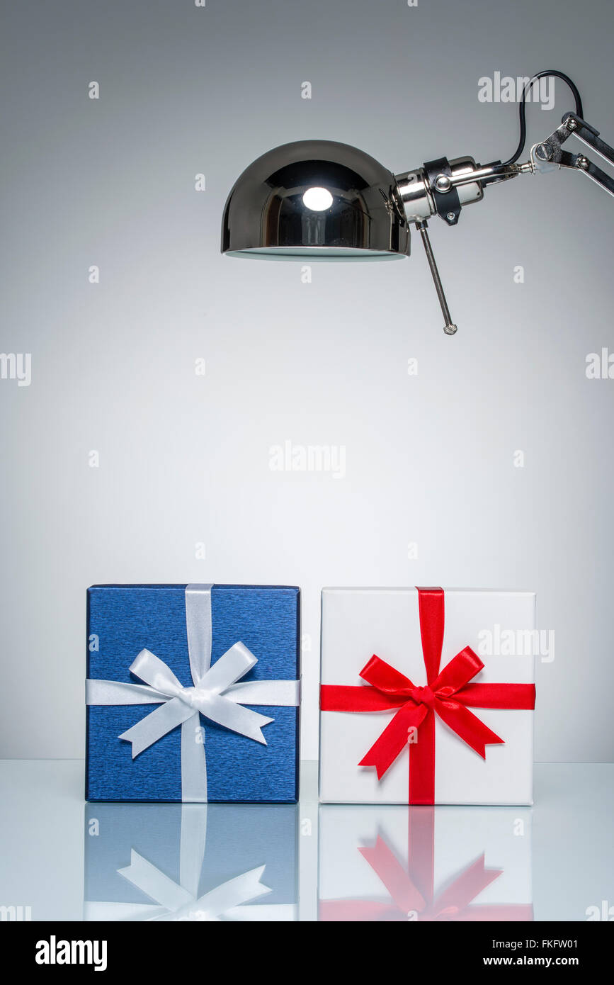 lighting up gift box present with desk lamp on round studio lighting ...