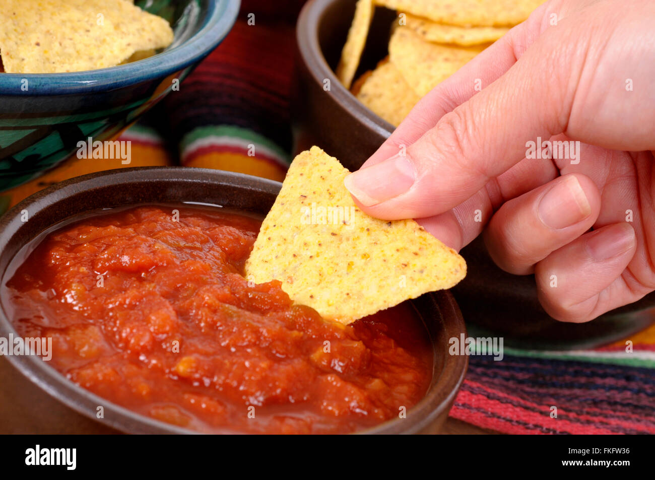 Mexican traditional serape blankets with salsa dip and tortilla chips ...